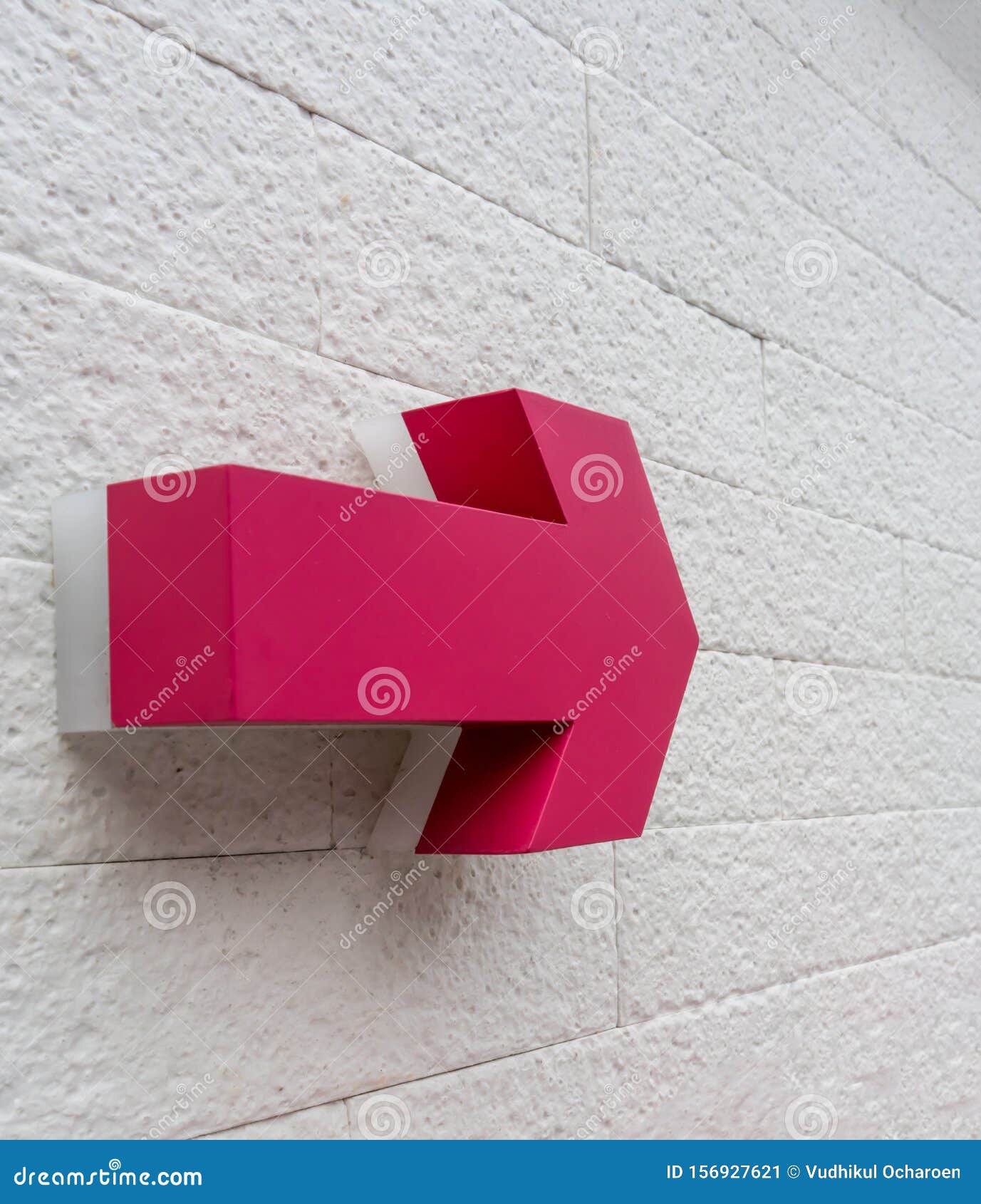 Pink Arrow Sign Hanging Against White Bricks Wall Stock Image - Image ...