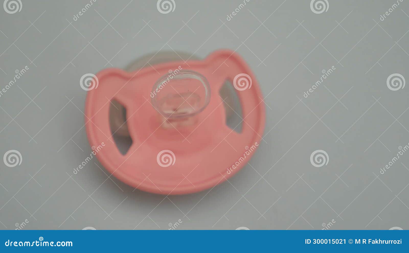 Pink baby pacifier on blue stock video. Video of child - 300015021