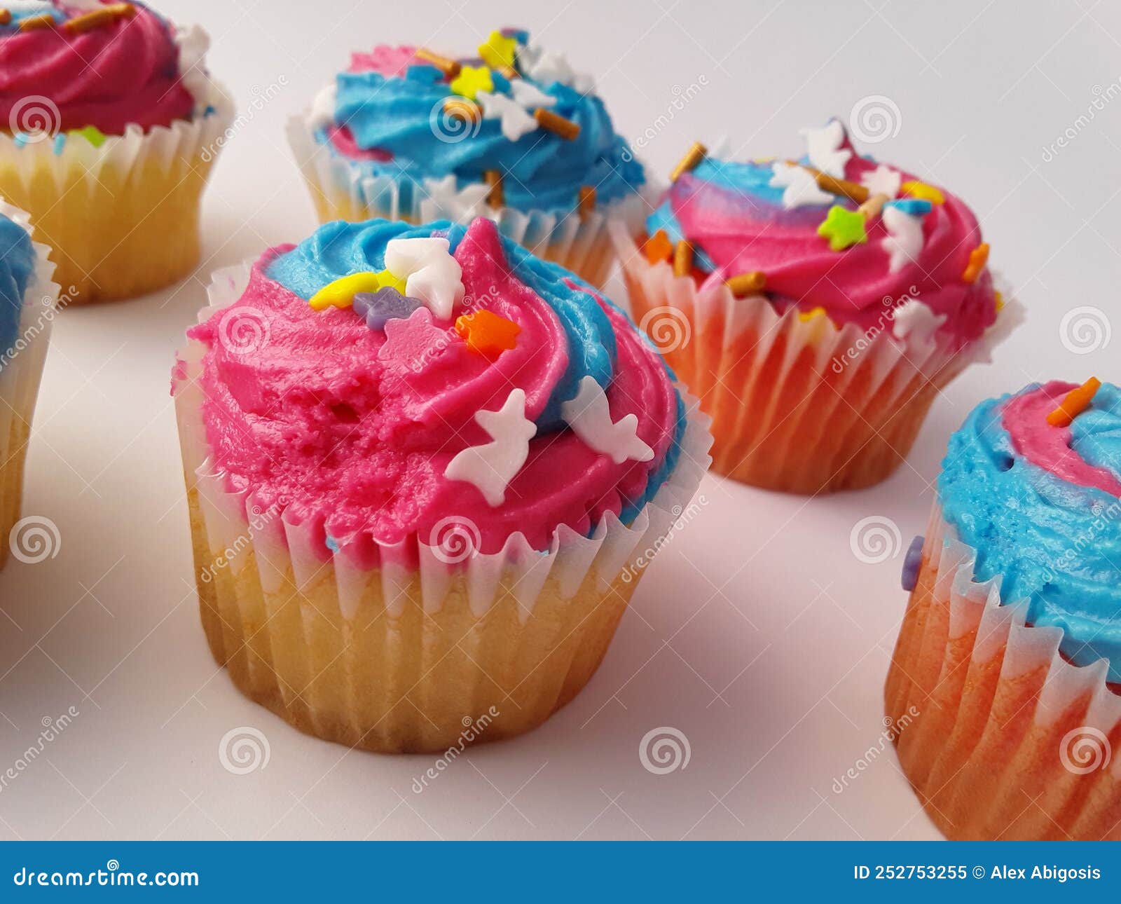Pink and Blue Cupcakes on a White Background Stock Image - Image of ...