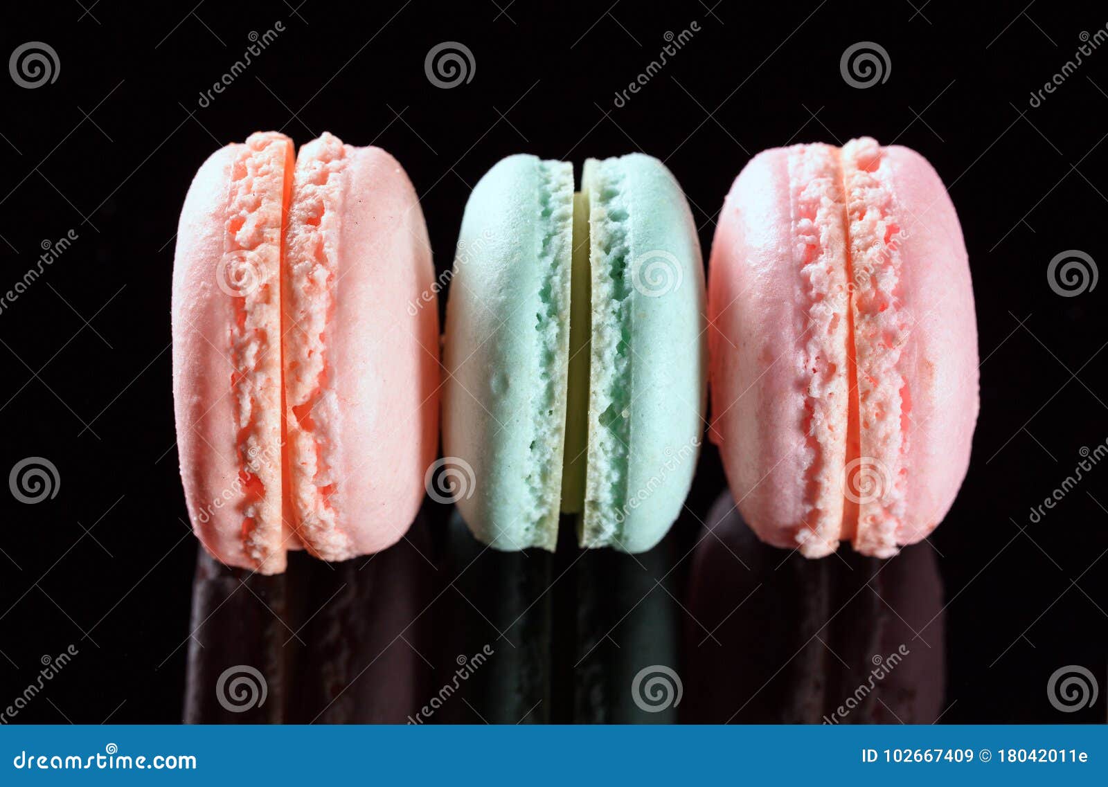 Pink and Blue Macarons Isolated on Black Background Stock Image - Image ...