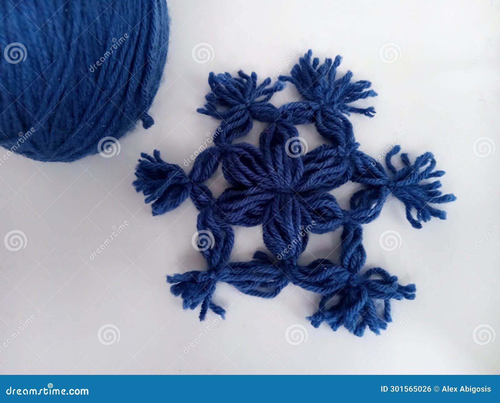 Blue Wool Snowflake on a White Background Stock Photo - Image of ...