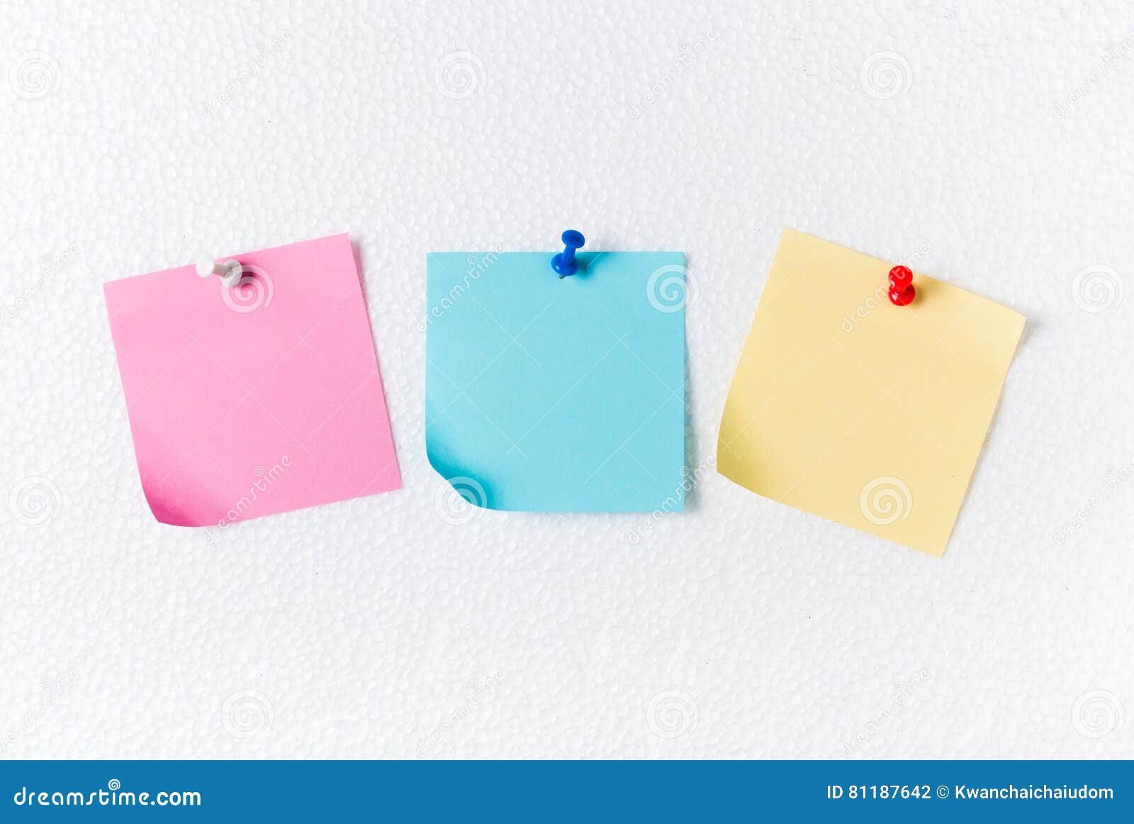 Pink Blue and Yellow Paper Note with Pin on Foam Sheet Stock Photo ...