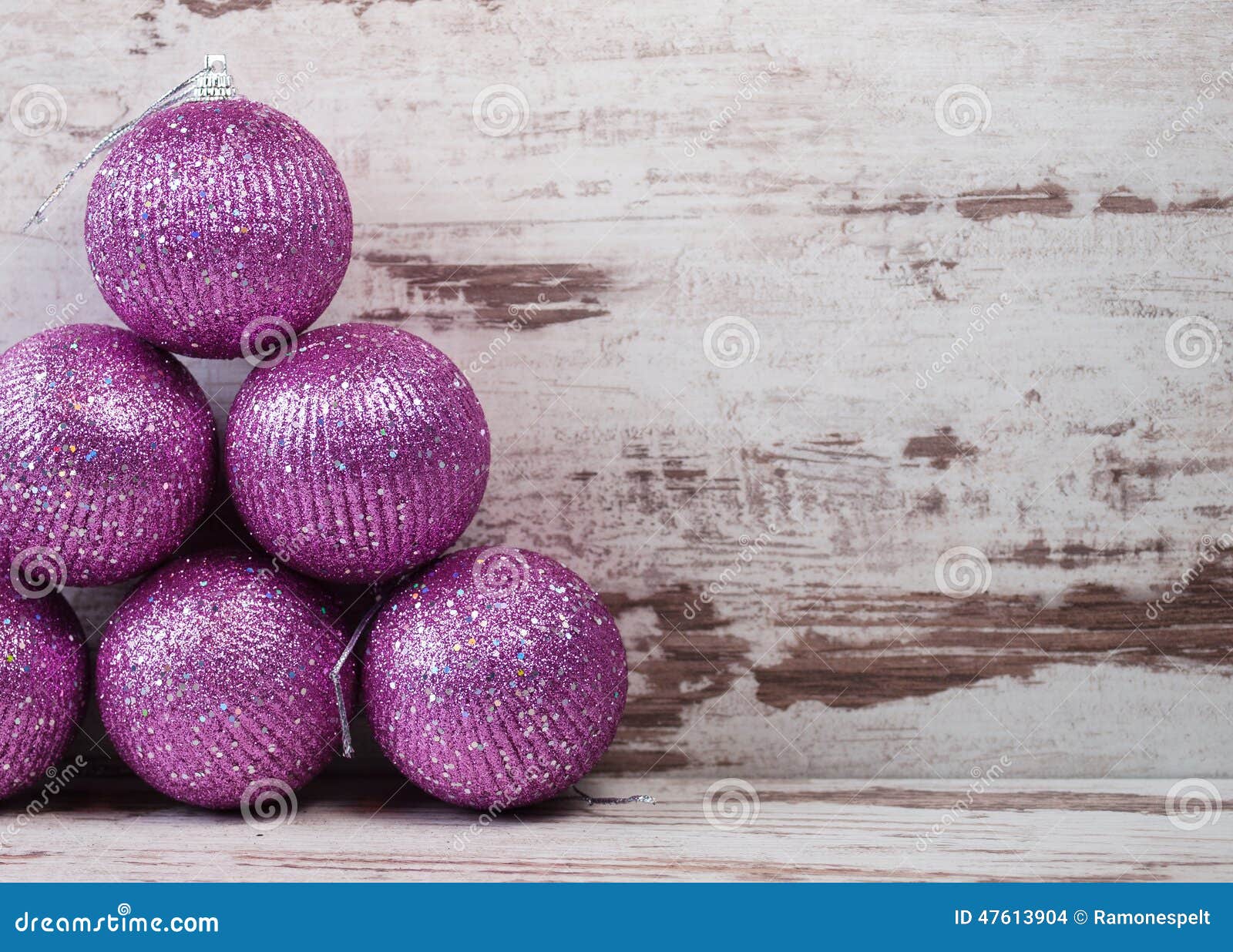 Pink Christmas Balls in a Stack Over Wooden Background Stock Photo ...
