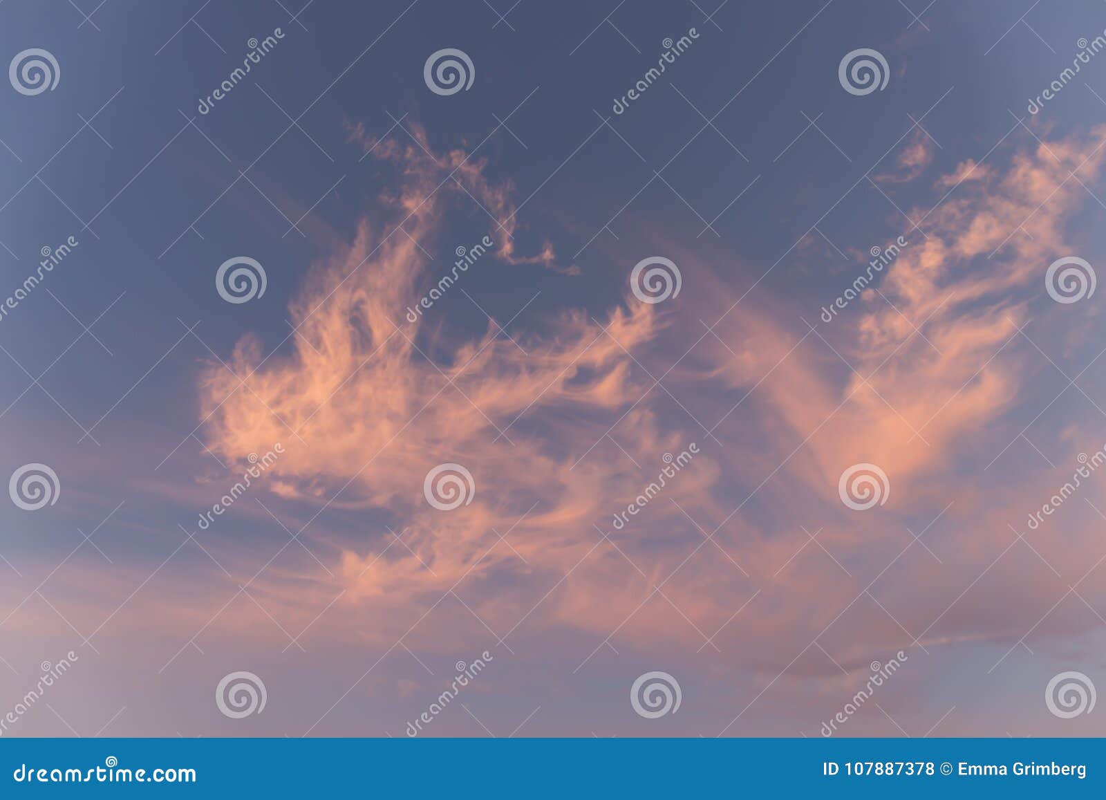 Pink Clouds in the Blue Sky in the Rays of the Sun Stock Photo - Image ...