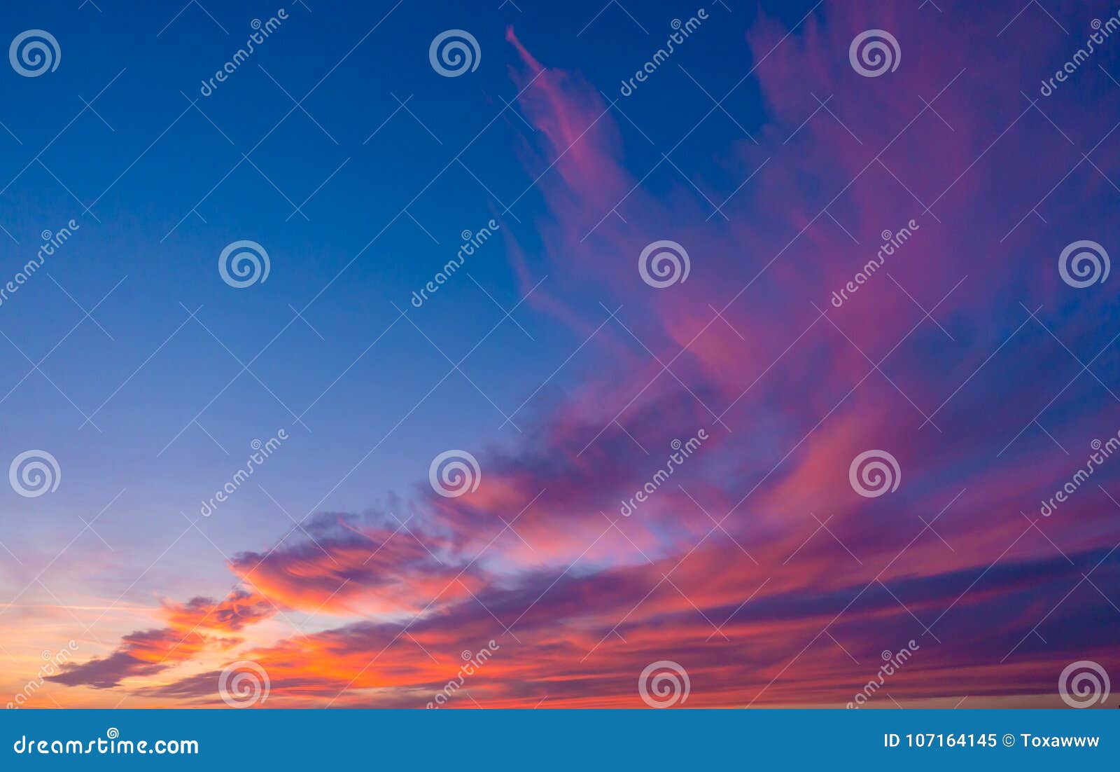 Pink clouds at a sunset stock image. Image of beach - 107164145