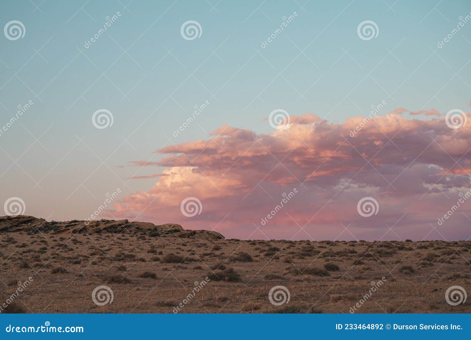 Pink Clouds at Sunset and Desolate Flat Landscape, Copy Space for Text ...
