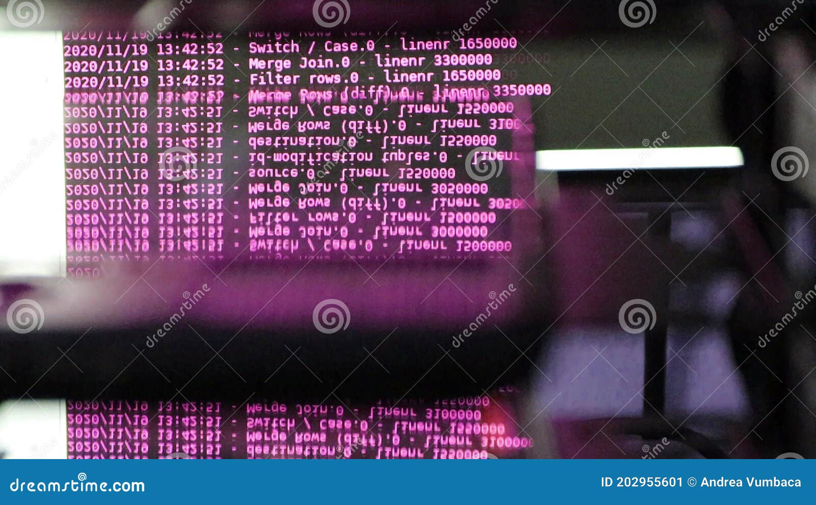 Pink Computer Software Code Moving on a Black Monitor Reflect on Glass ...