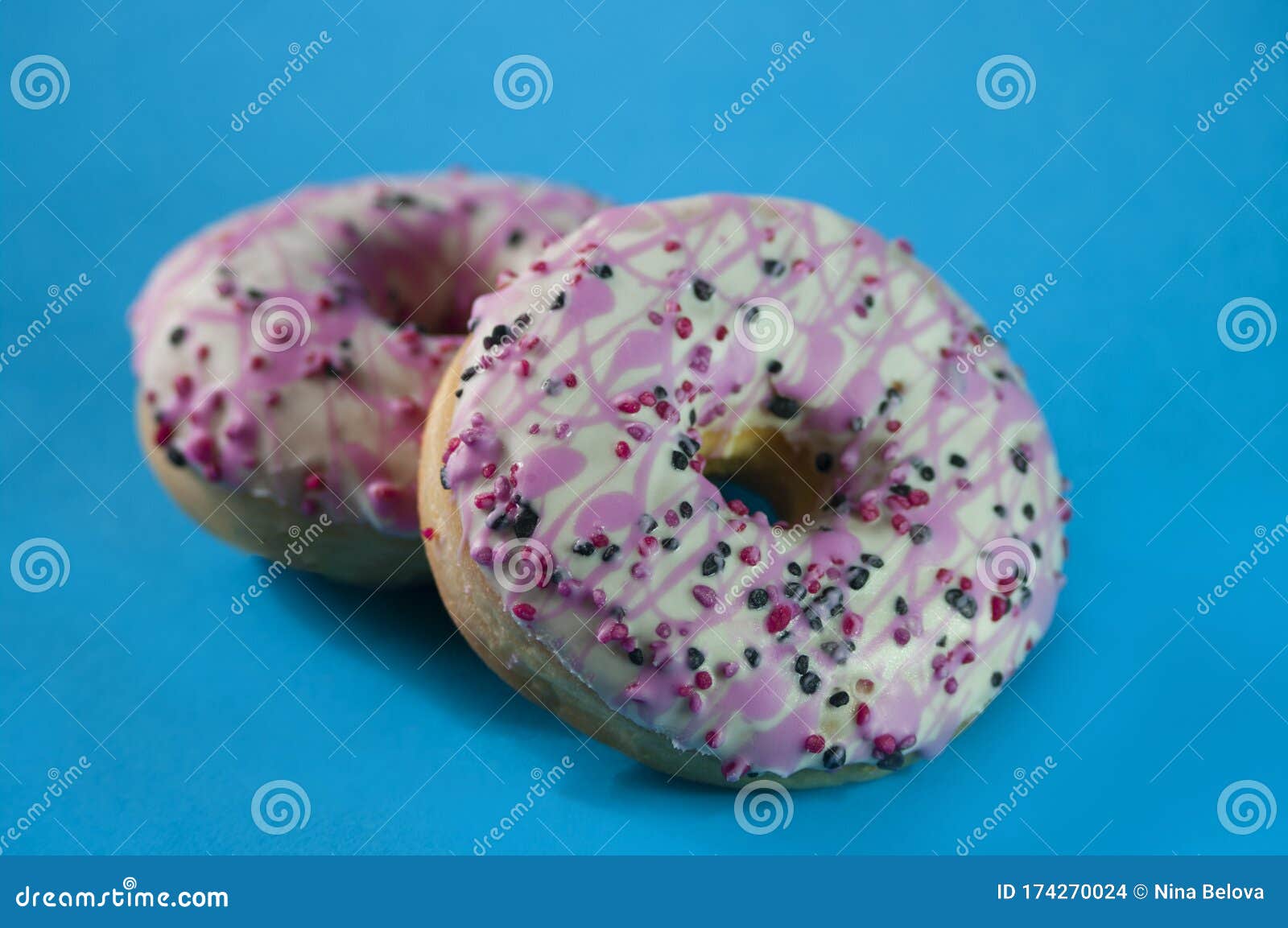 Pink Donuts Glazed Stuffed with Strawberry Jam, Blue Background Stock ...