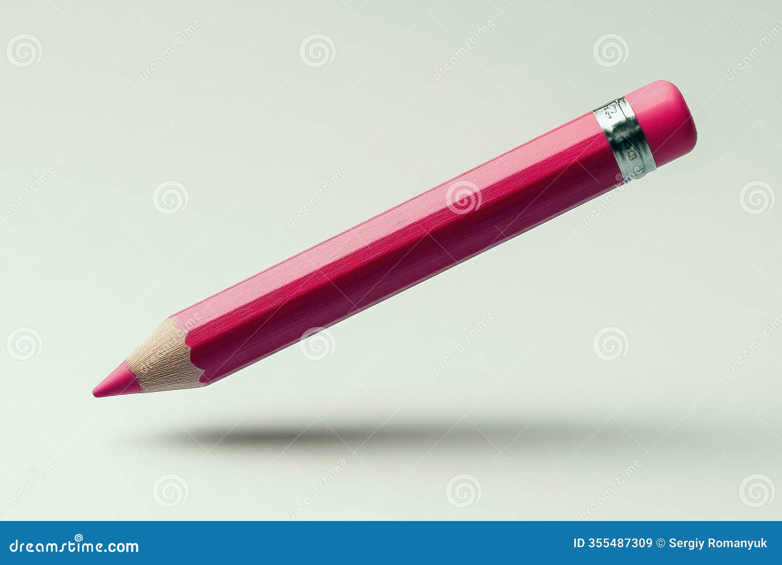 Pink Eraser Pencil Floating Against a Solid White Background in a ...