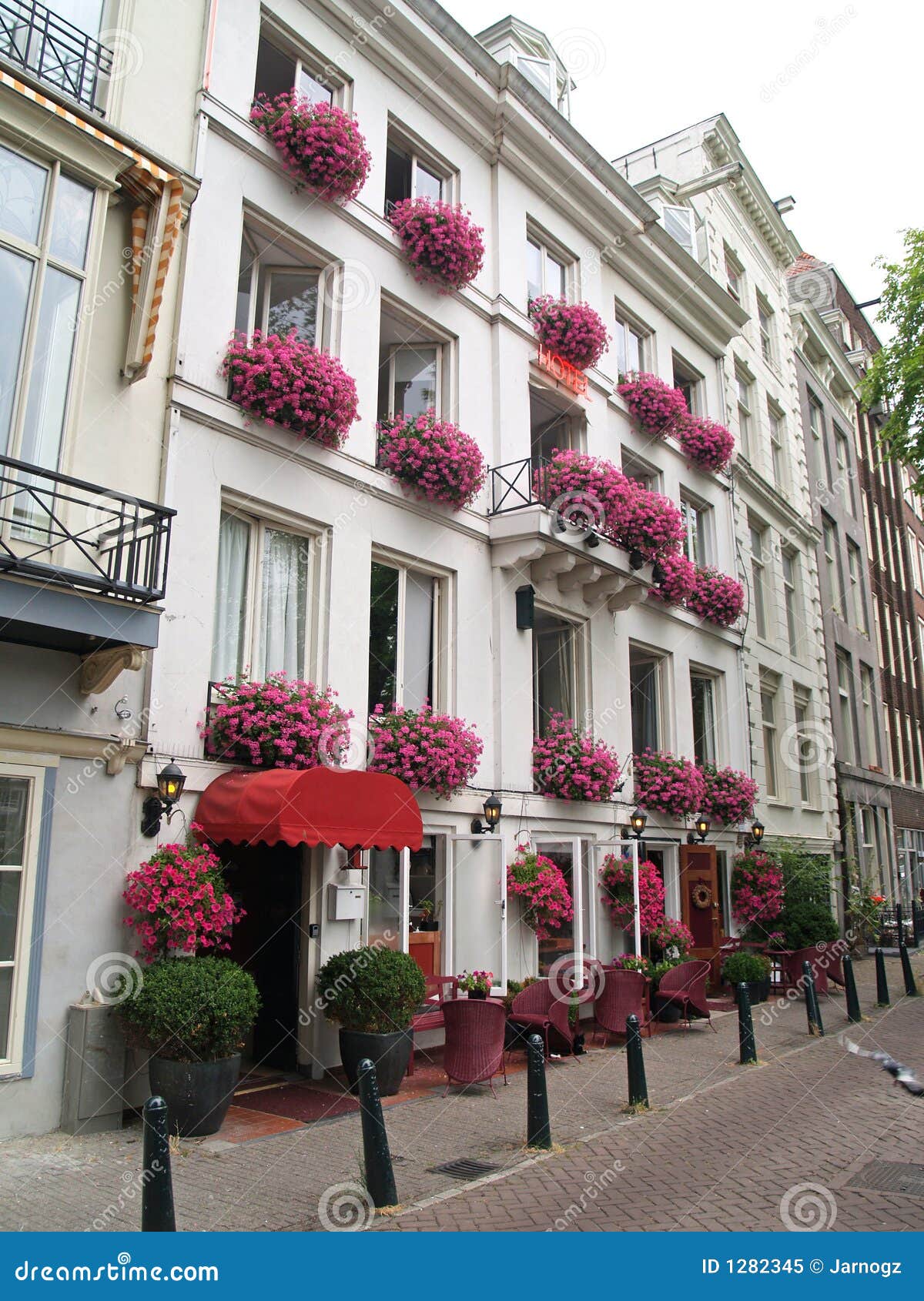 Pink flower facade Hotel stock image. Image of bold, medieval - 1282345
