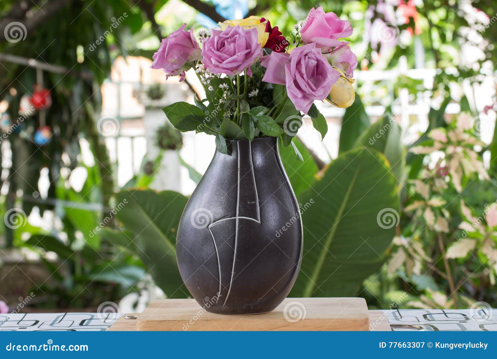 Pink flowers in black jug stock image. Image of pitcher - 77663307