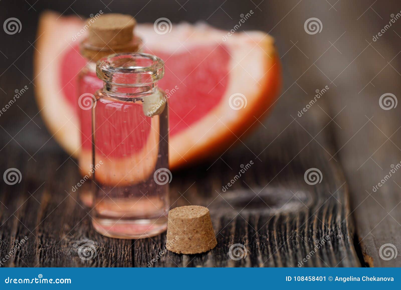 Pink Grapefruit Oil and Fruit on the Table Stock Image - Image of ...