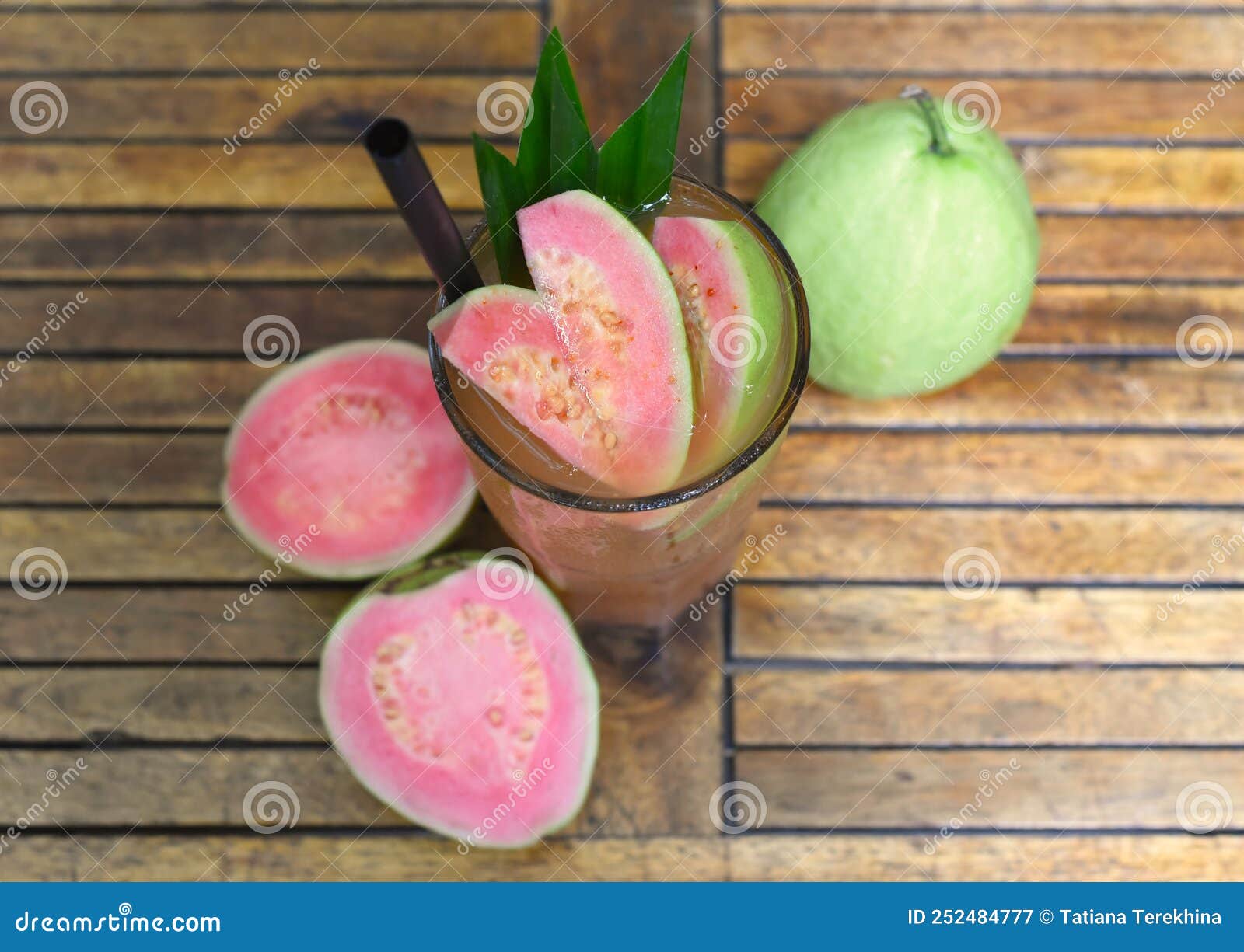 Pink Guava Ice Tea on Wooden Table Background with Sliced Guava Stock ...
