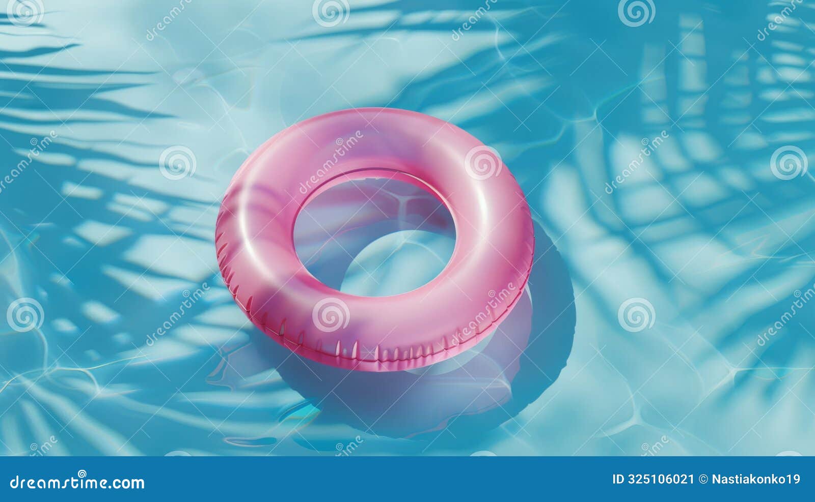 Pink Inflatable Ring Floating in a Swimming Pool with Palm Tree Shadows ...