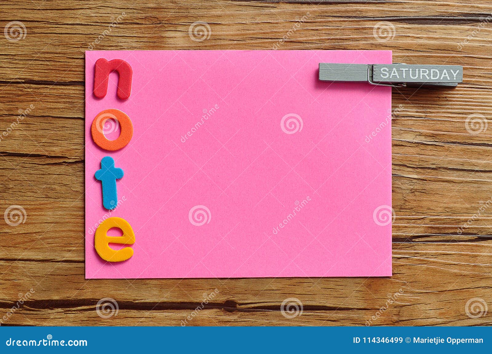 A Pink Note with the Word Note and a Peg Attached with the Word ...
