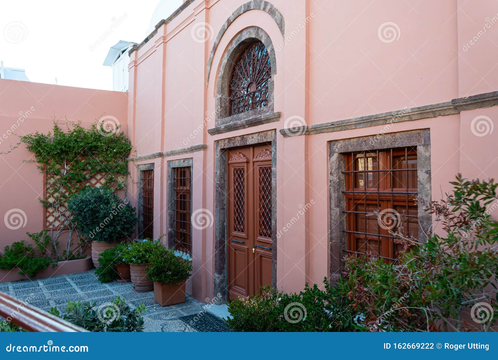 Pink painted building stock photo. Image of plant, shutters - 162669222