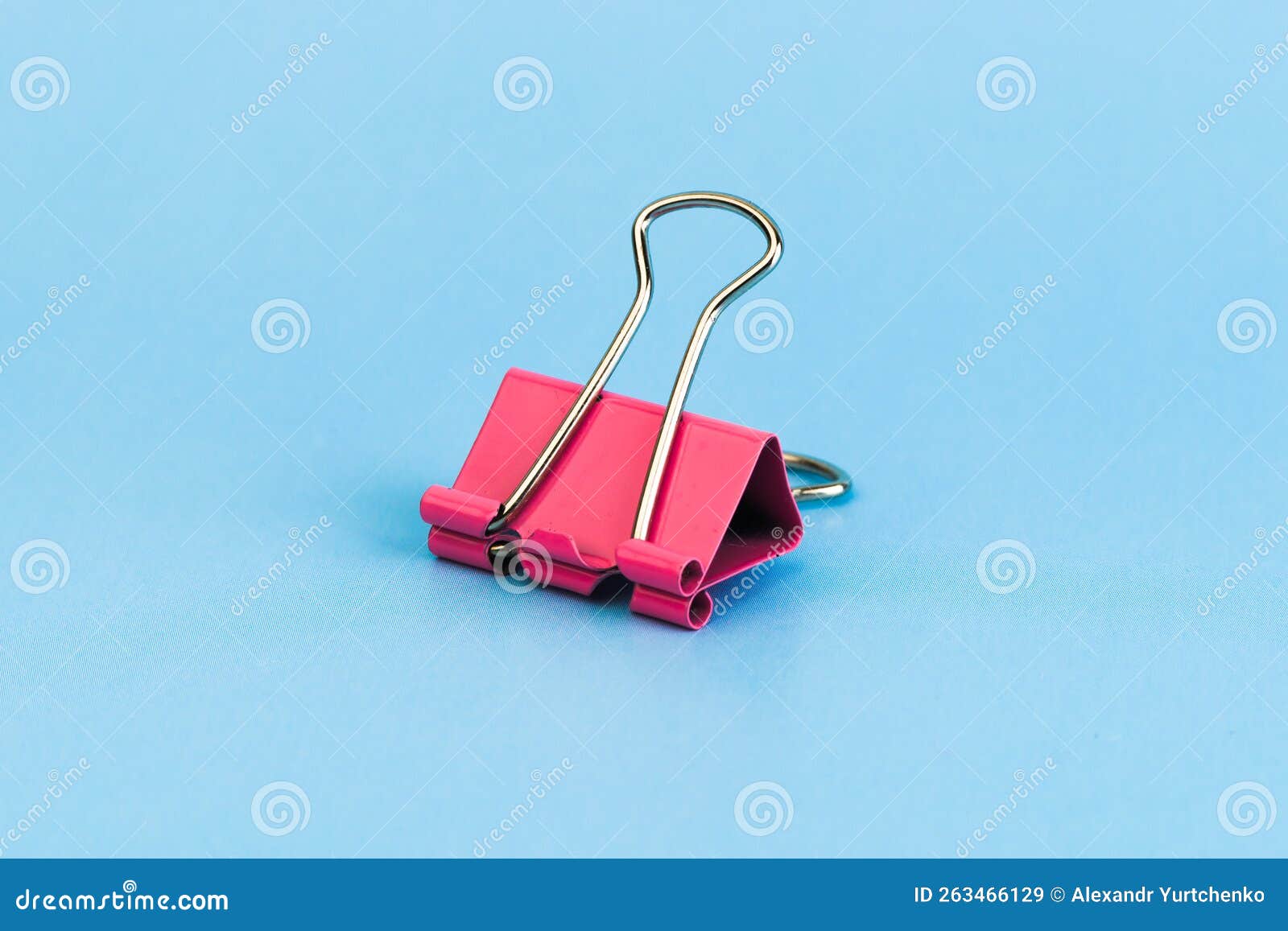 Pink Paper Clamp Isolated on Blue Stock Image - Image of clip, paper ...