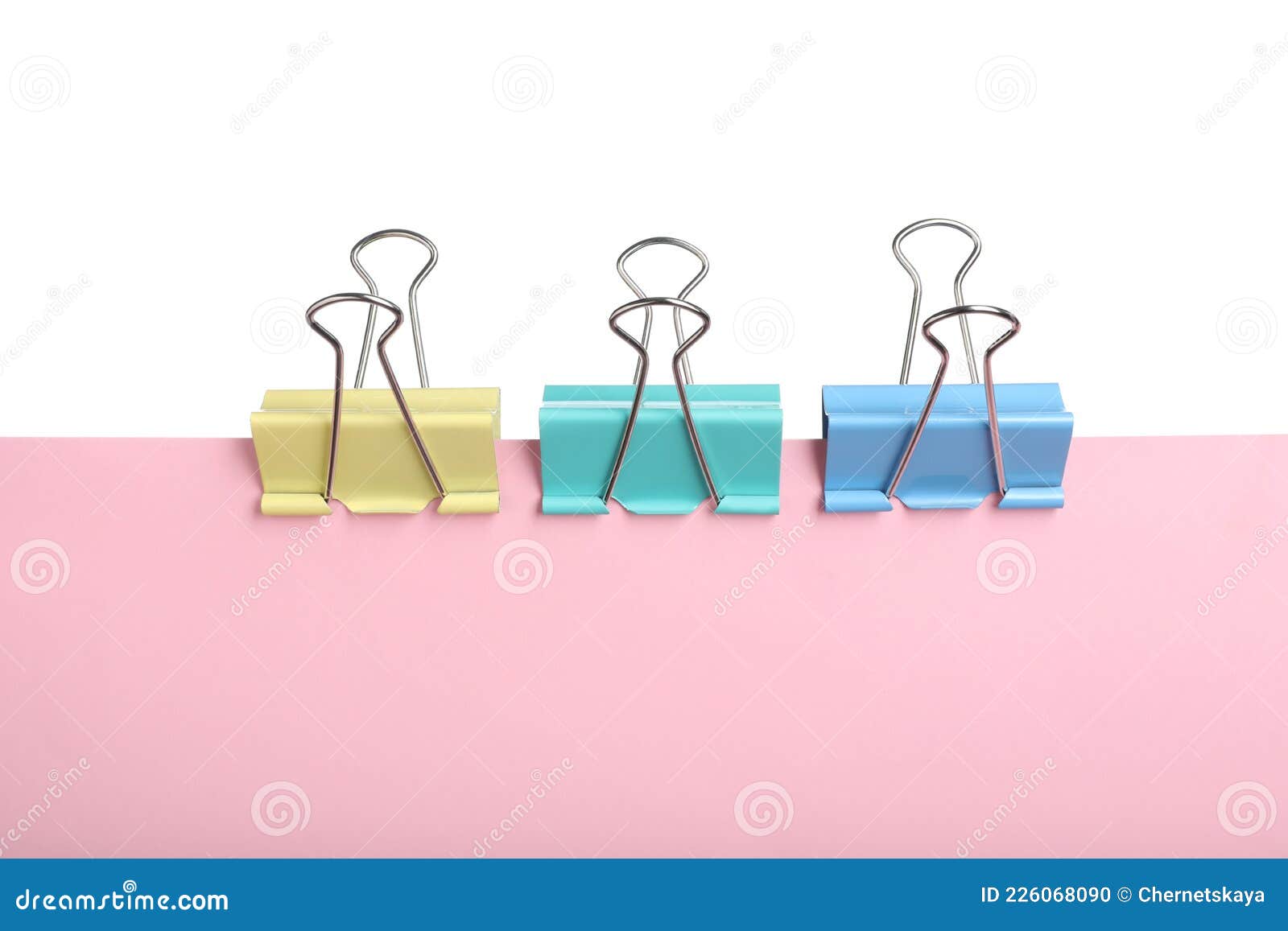 Pink Paper with Colorful Binder Clip Isolated on White Stock Photo ...