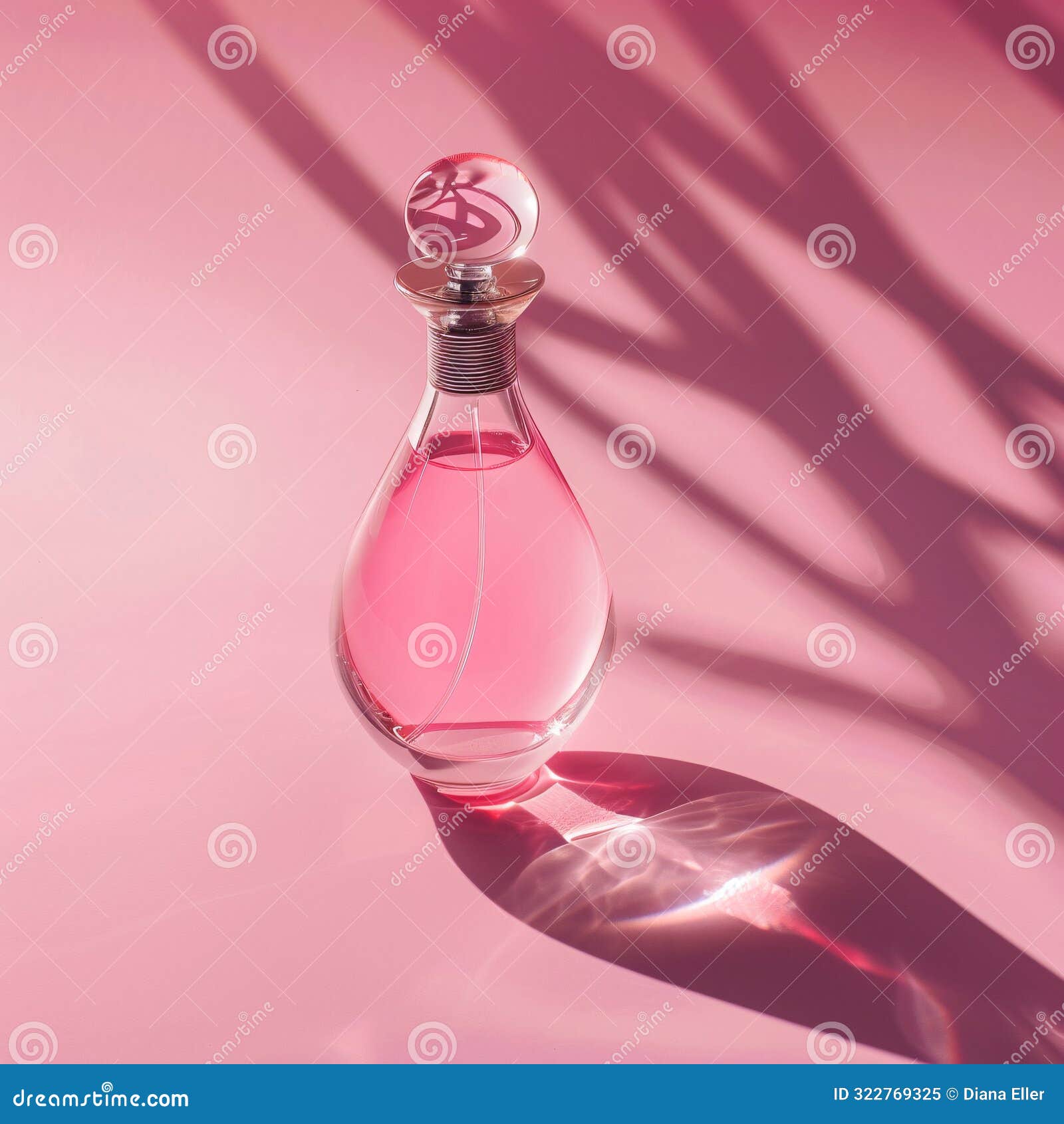 Pink Perfume Bottle on Pink Background with Shadows and Light Stock ...
