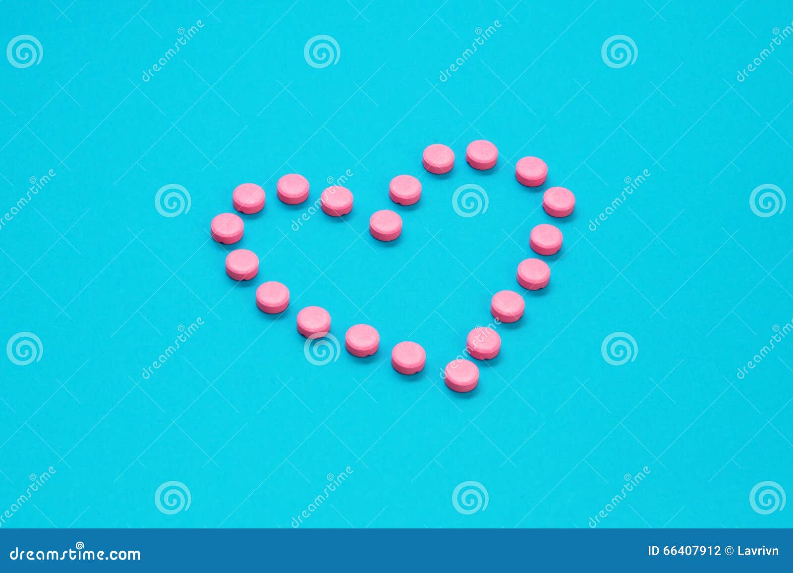 Pink Pills in Heart Shape on Blue Background Stock Photo - Image of ...