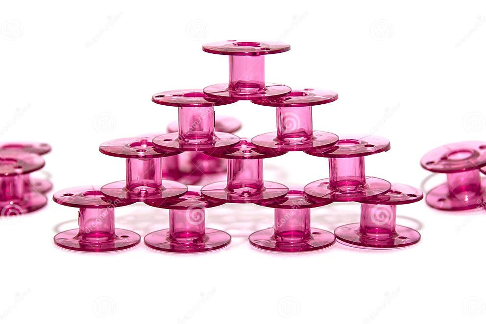 Pink Plastic Bobbin for Sewing Machine Stock Photo - Image of sewing ...