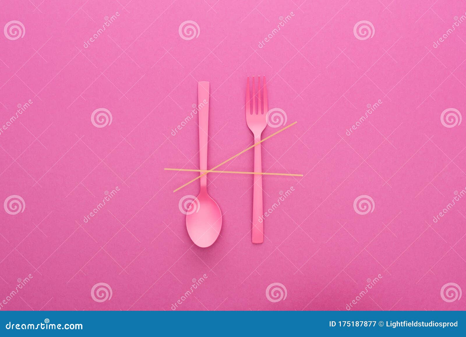Pink Plastic Spoon Upside Down and Fork with Spaghetti Isolated on Pink ...