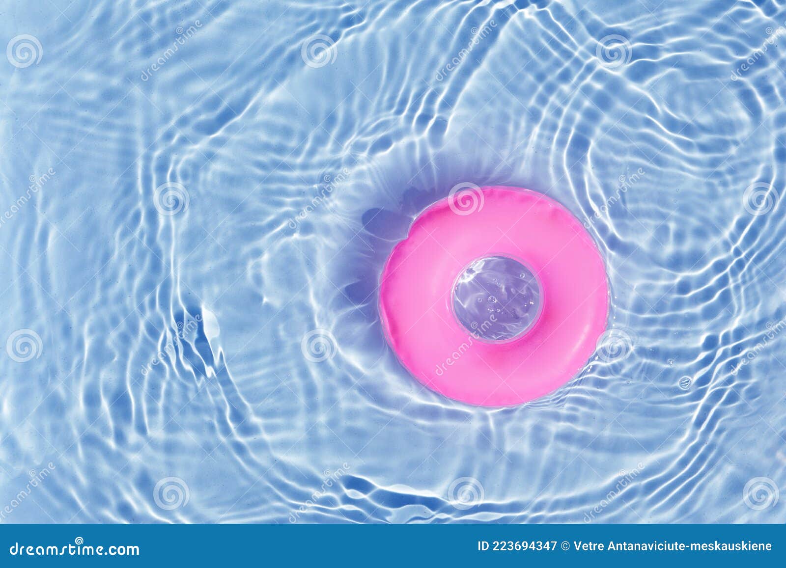 Pink Pool Float Ring Floating in a Refreshing Blue Swimming Pool. Top ...