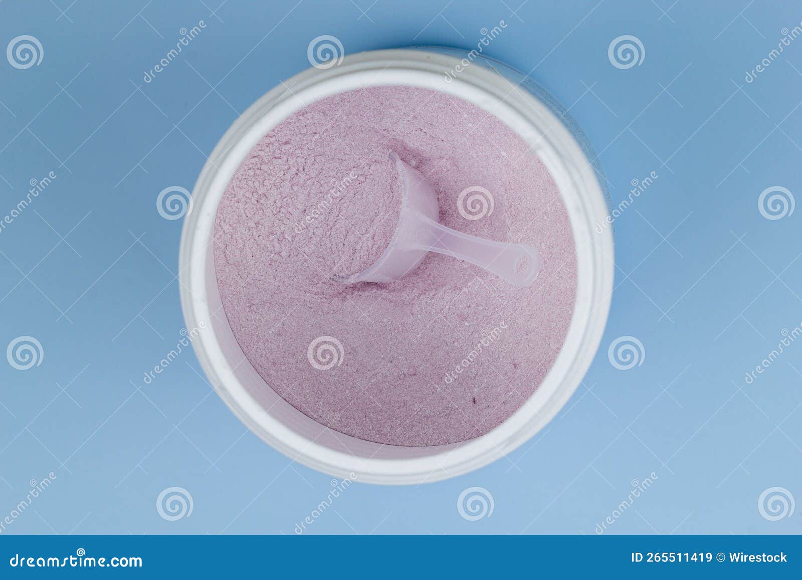 Pink Protein Powder with Spoon in Blue Background Stock Image - Image ...