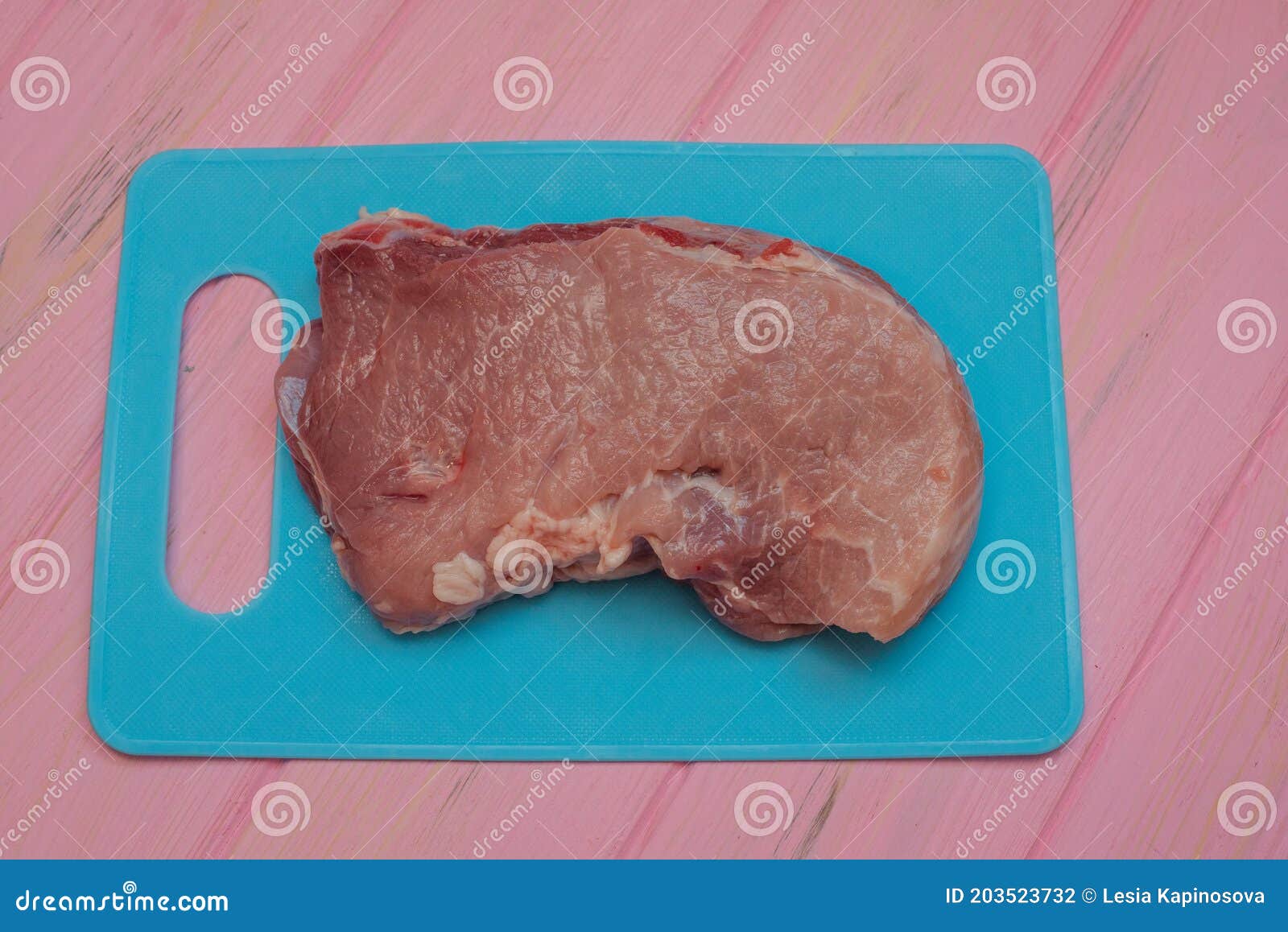 Pink Raw Pork Lie on a Blue Board. Appetizing Meat. Pork on Blue Board ...