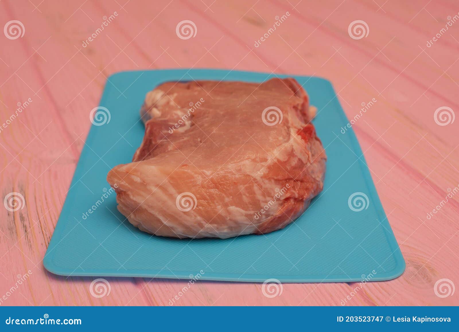 Pink Raw Pork Lie on a Blue Board. Appetizing Meat. Pork on Blue Board ...