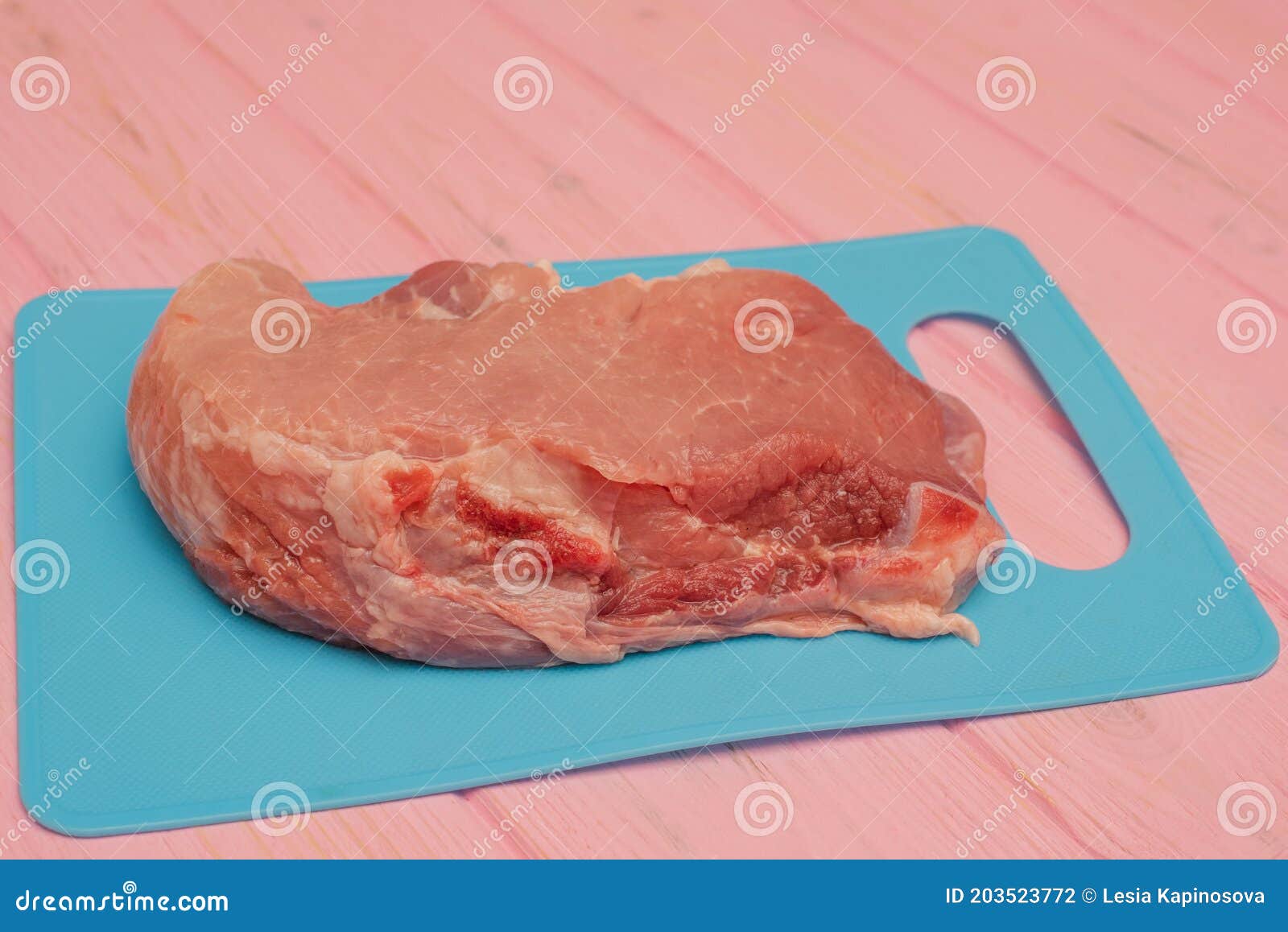 Pink Raw Pork Lie on a Blue Board. Appetizing Meat. Pork on Blue Board ...