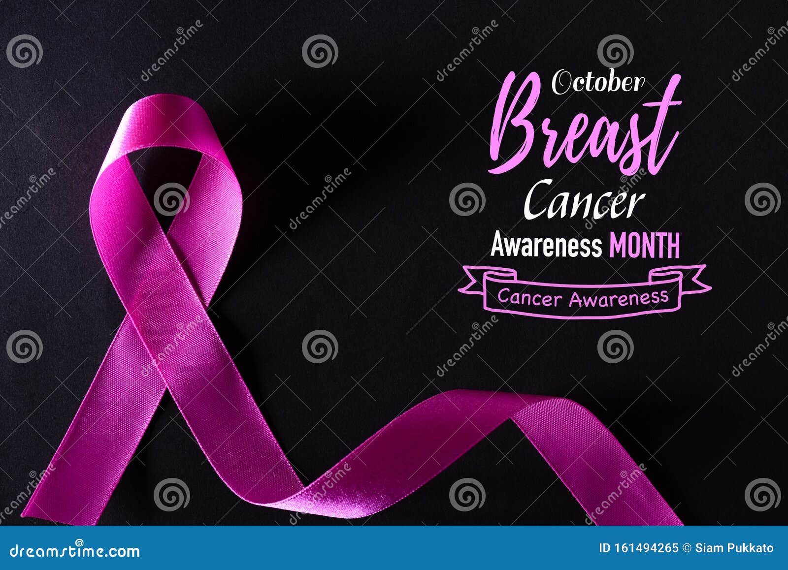 Pink Ribbon On Black Paper Background For Supporting Breast Cancer