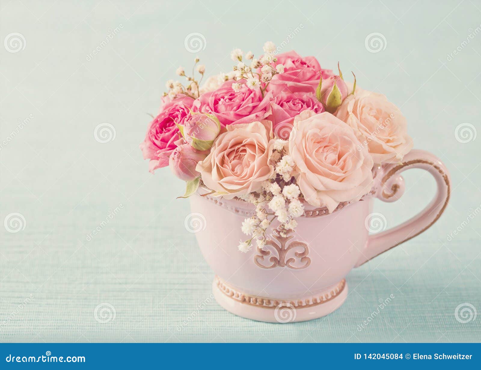 Pink roses in a teacup stock photo. Image of stilllife - 142045084