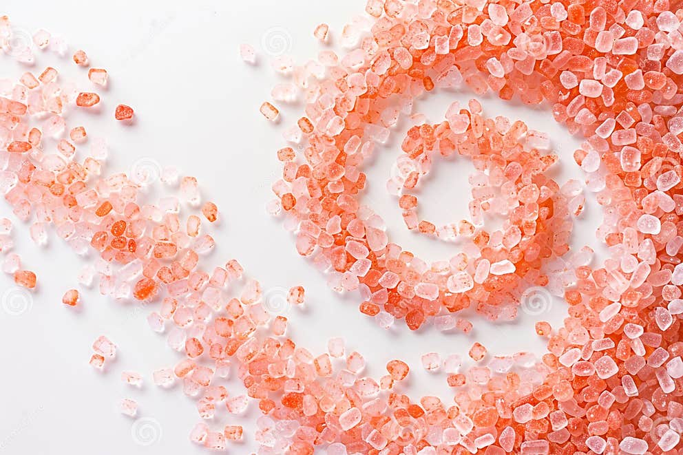 Pink Salt Forming a Delicate Spiral Shape on a Solid White Background ...