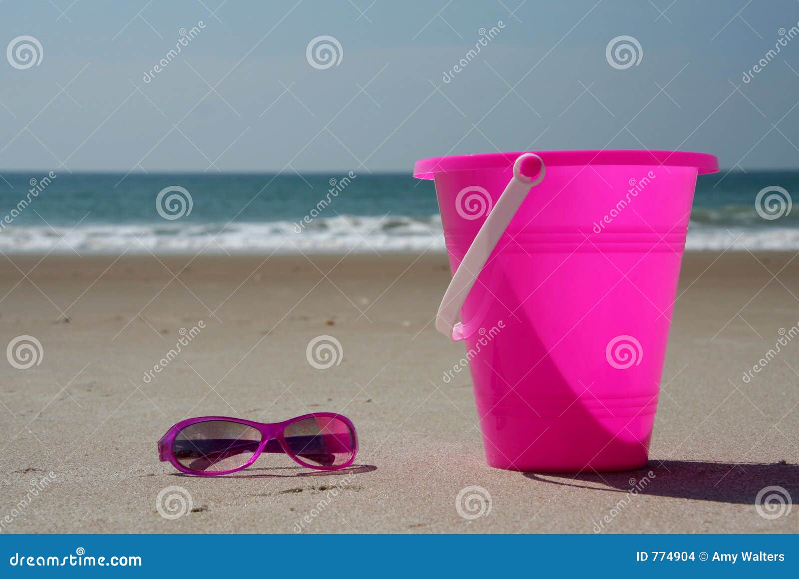 Pink Shades and Bucket on the Beach Stock Photo - Image of relaxation ...