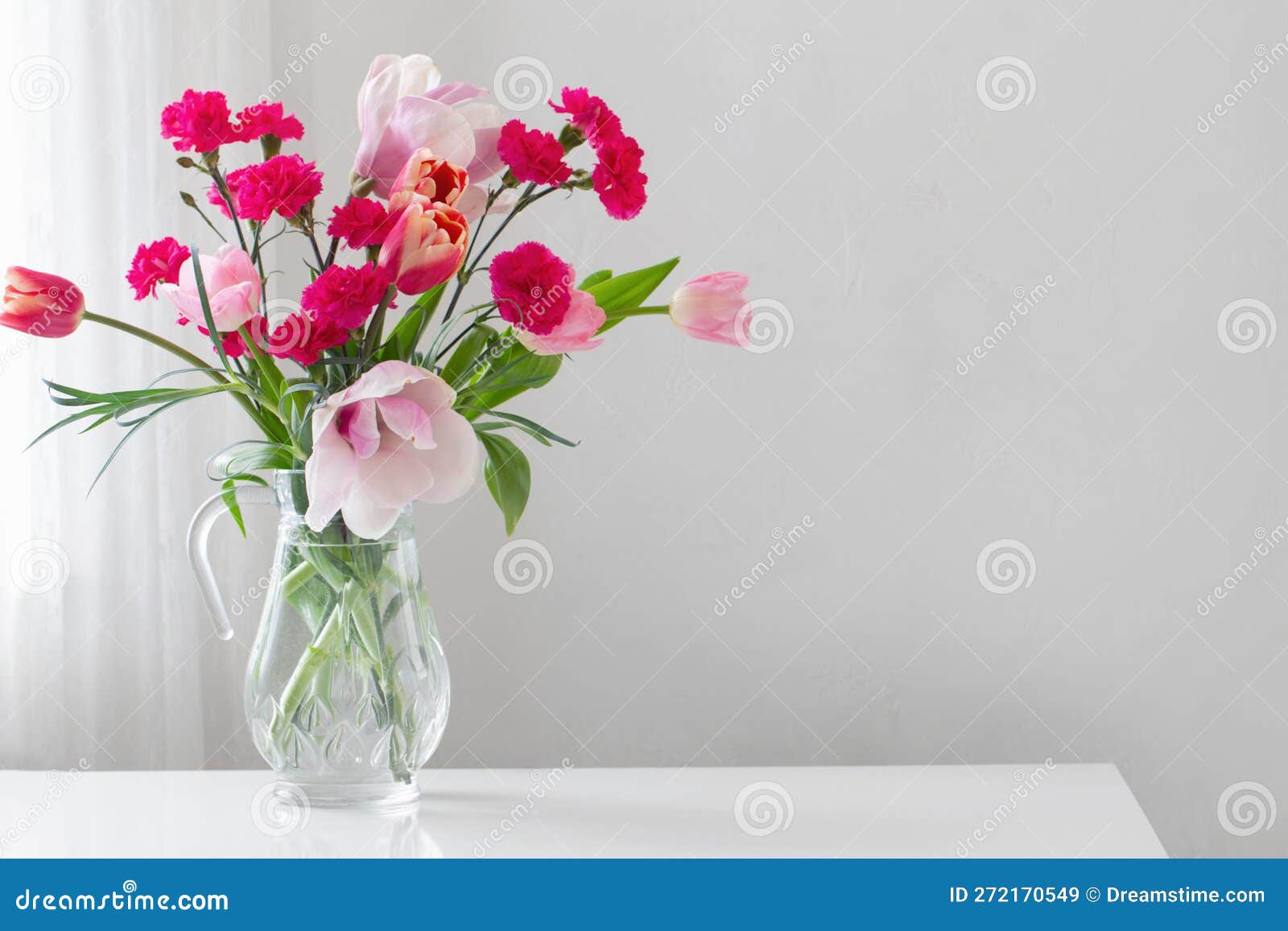 Pink Spring Flowers in Glass Jug on White Background Stock Image ...
