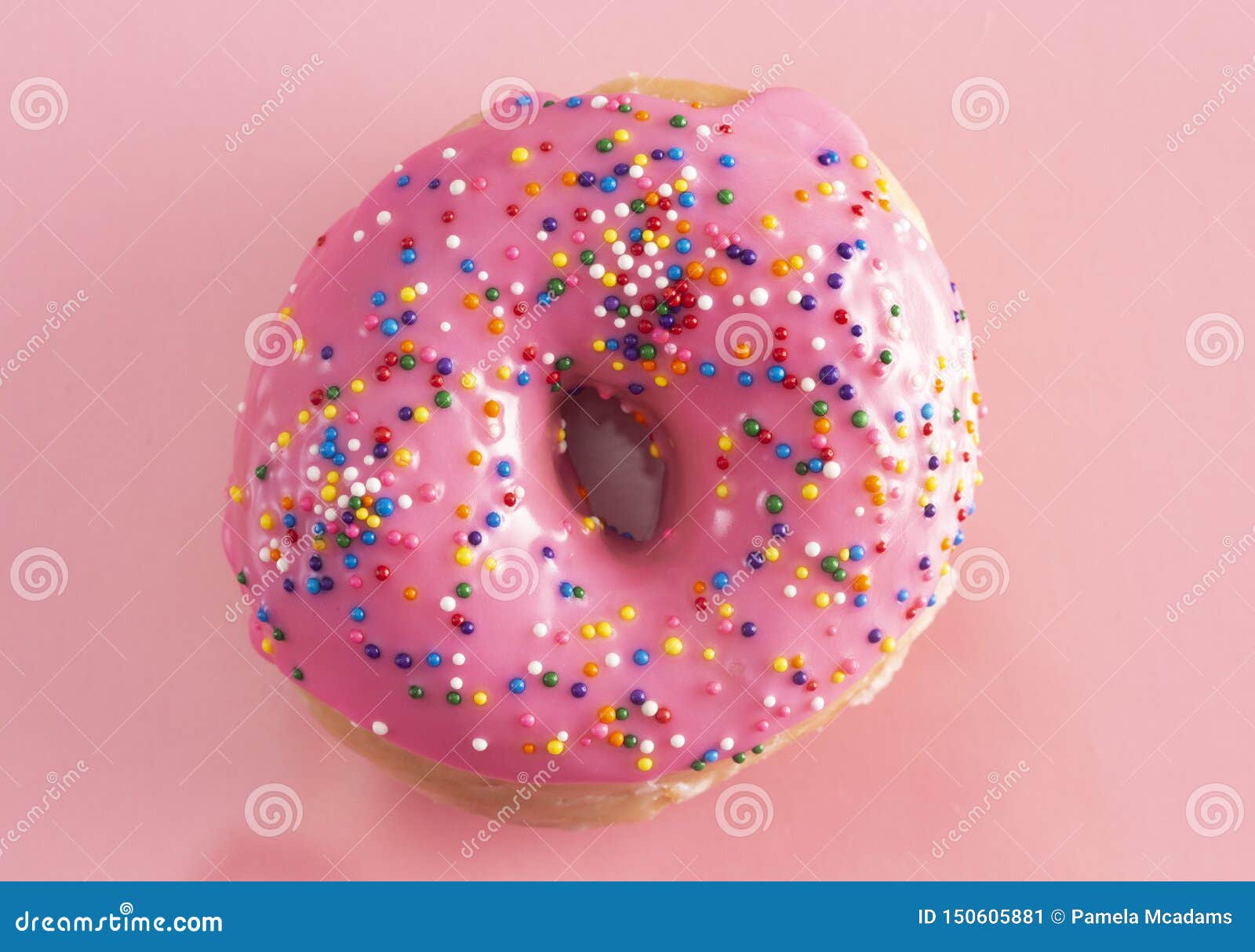 A Pink Sprinkle Donuts on a Pink Background Stock Image - Image of ...