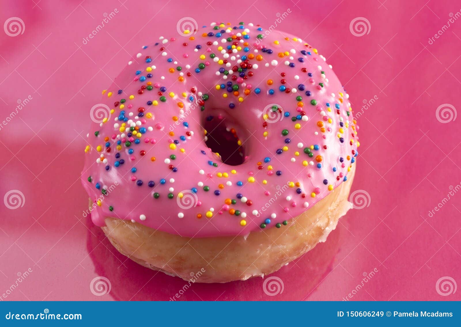 A Pink Sprinkle Donuts on a Pink Background Stock Image - Image of ...