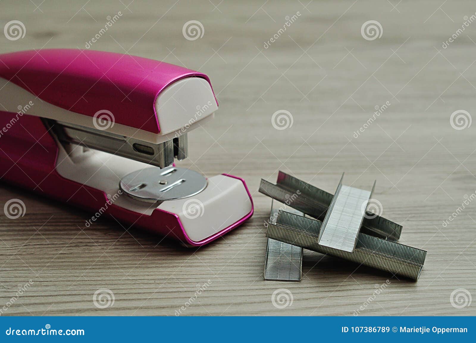 A Pink Stapler with a Pile of Staplers Stock Image - Image of plastic ...