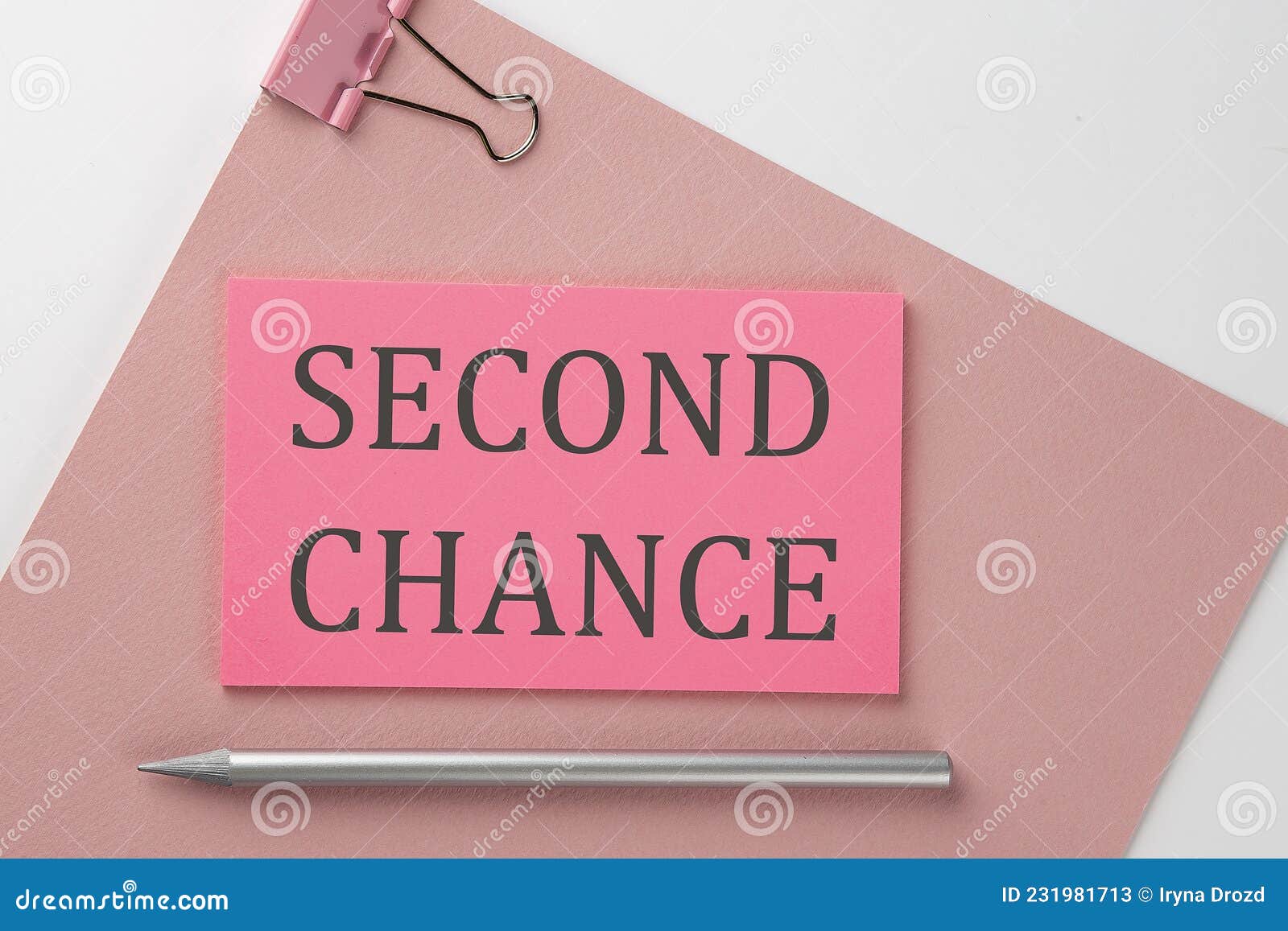 Pink Sticker on Pink Paper with Pencil on a White Background with Text ...