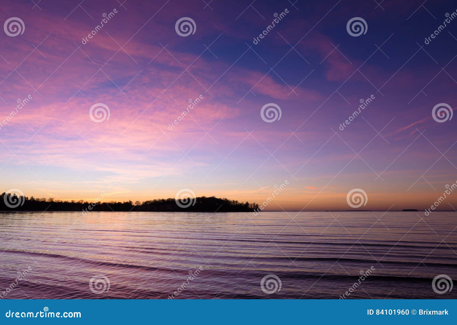 Pink sunset over the water stock photo. Image of trees - 84101960