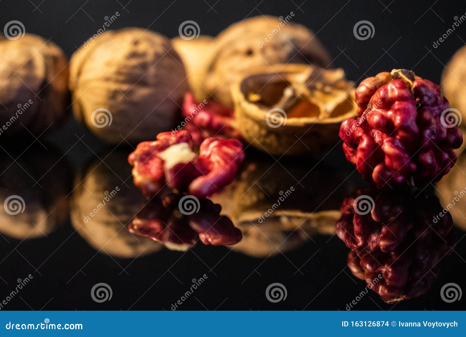 Pink Walnut Kernels on a Dark Reflective Table. Stock Photo - Image of ...