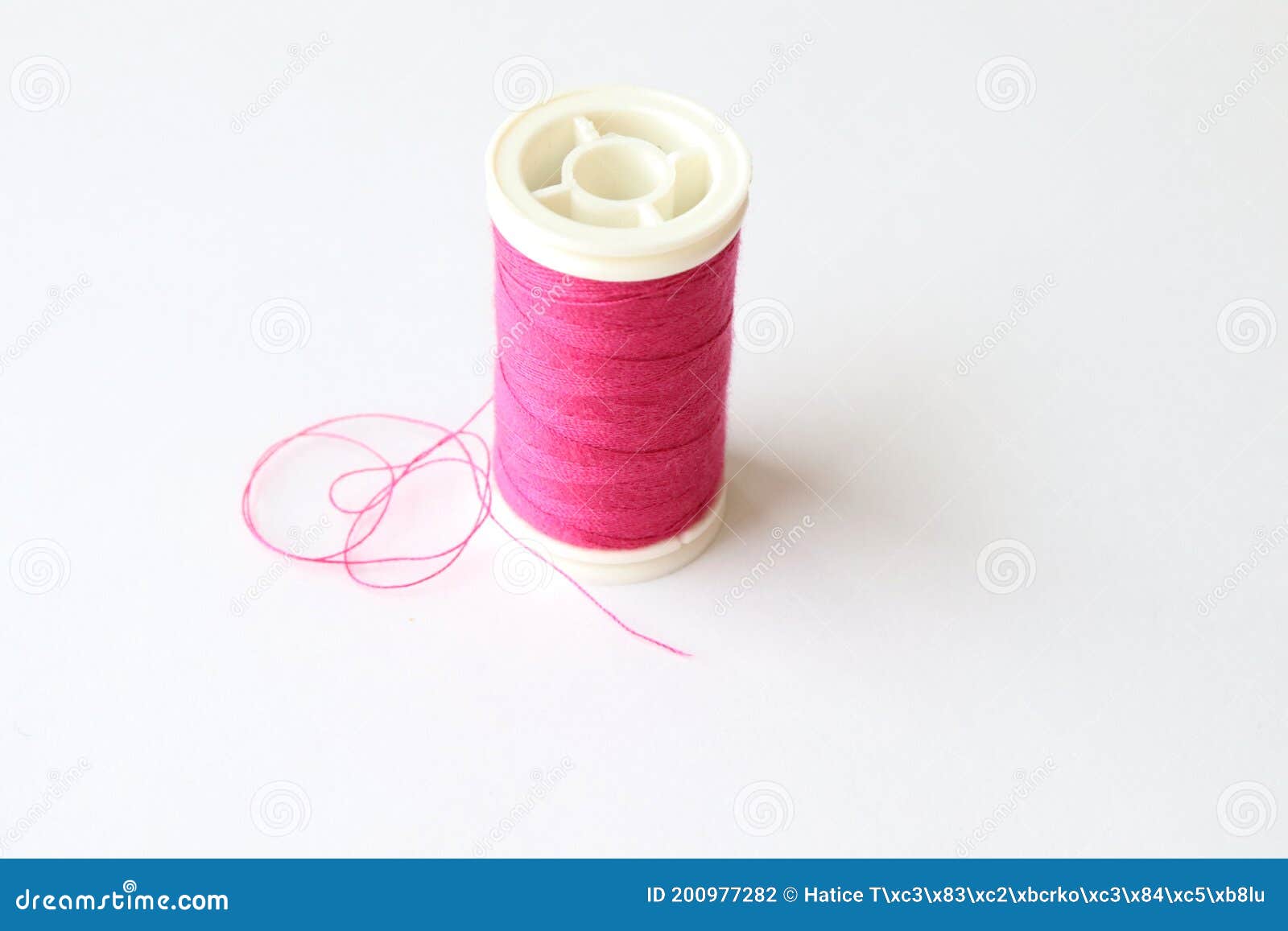 A Pink Wound Spool of Sewing Thread Stock Photo - Image of ground ...