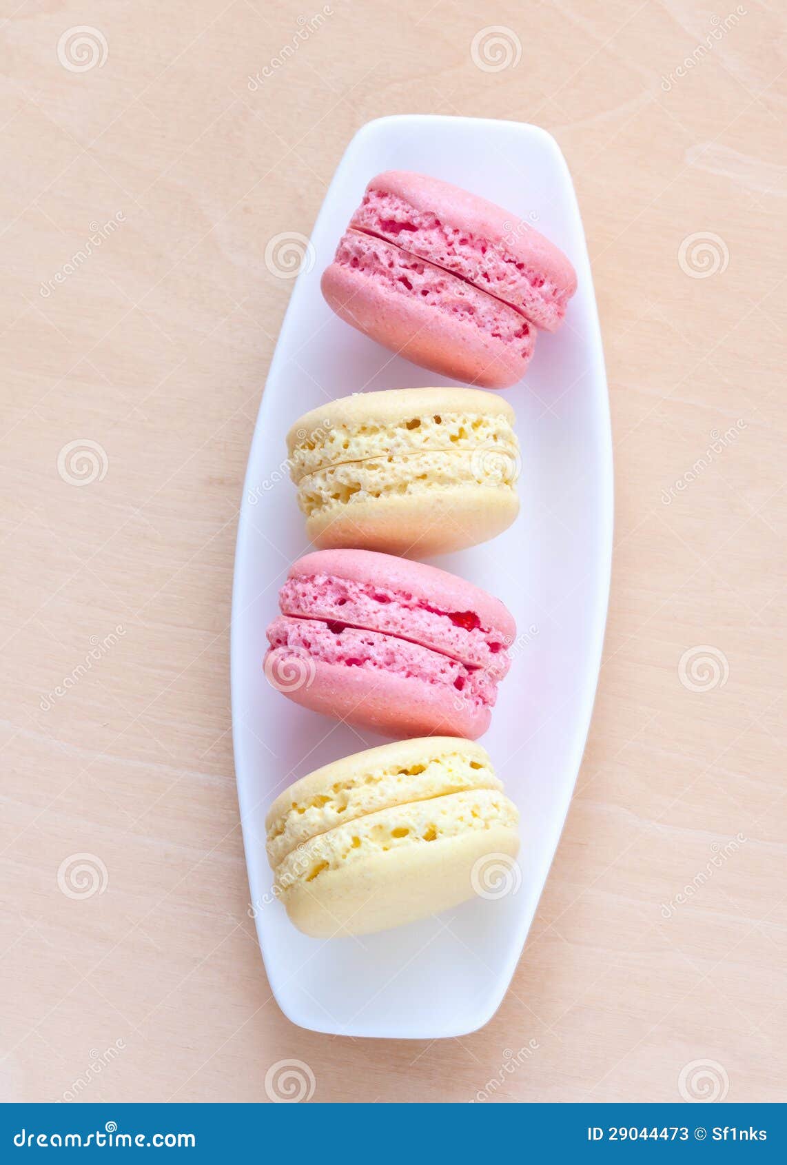 Pink and Yellow Macaron on a Plate Stock Image - Image of confection ...