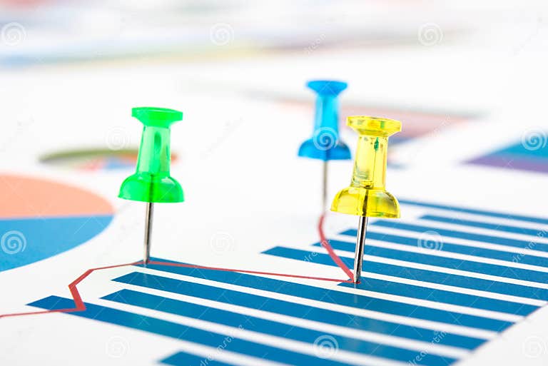 Pins on an Graphs and Charts Stock Photo - Image of macro, money: 27574510