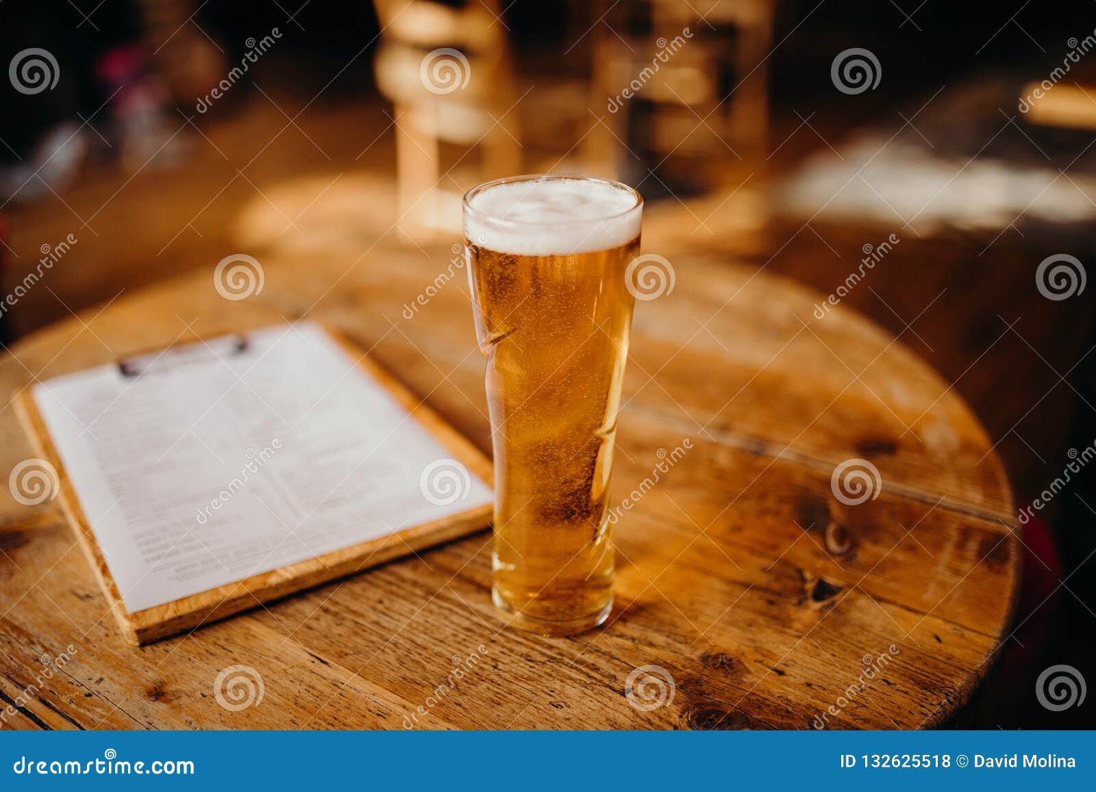 Pint of beer on a table. stock photo. Image of brewery - 132625518