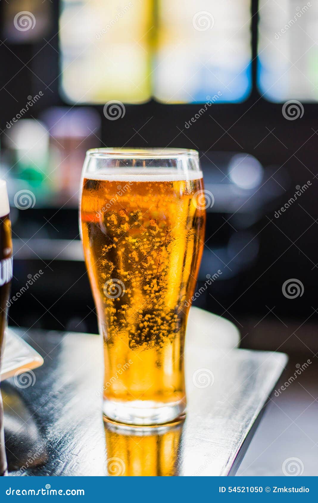 Pint of beers on the table stock photo. Image of gold - 54521050