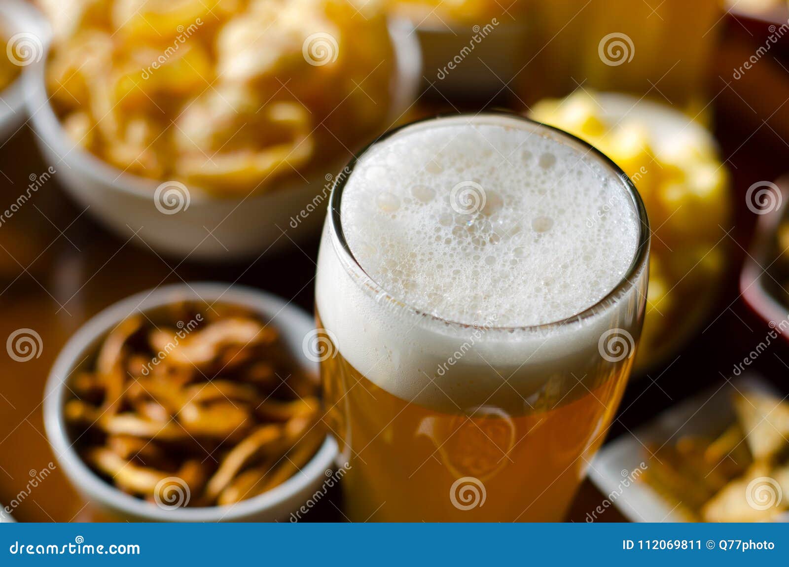 Pint of Lager Beer in a Glass, Set of Various Snacks, a Standard Stock ...