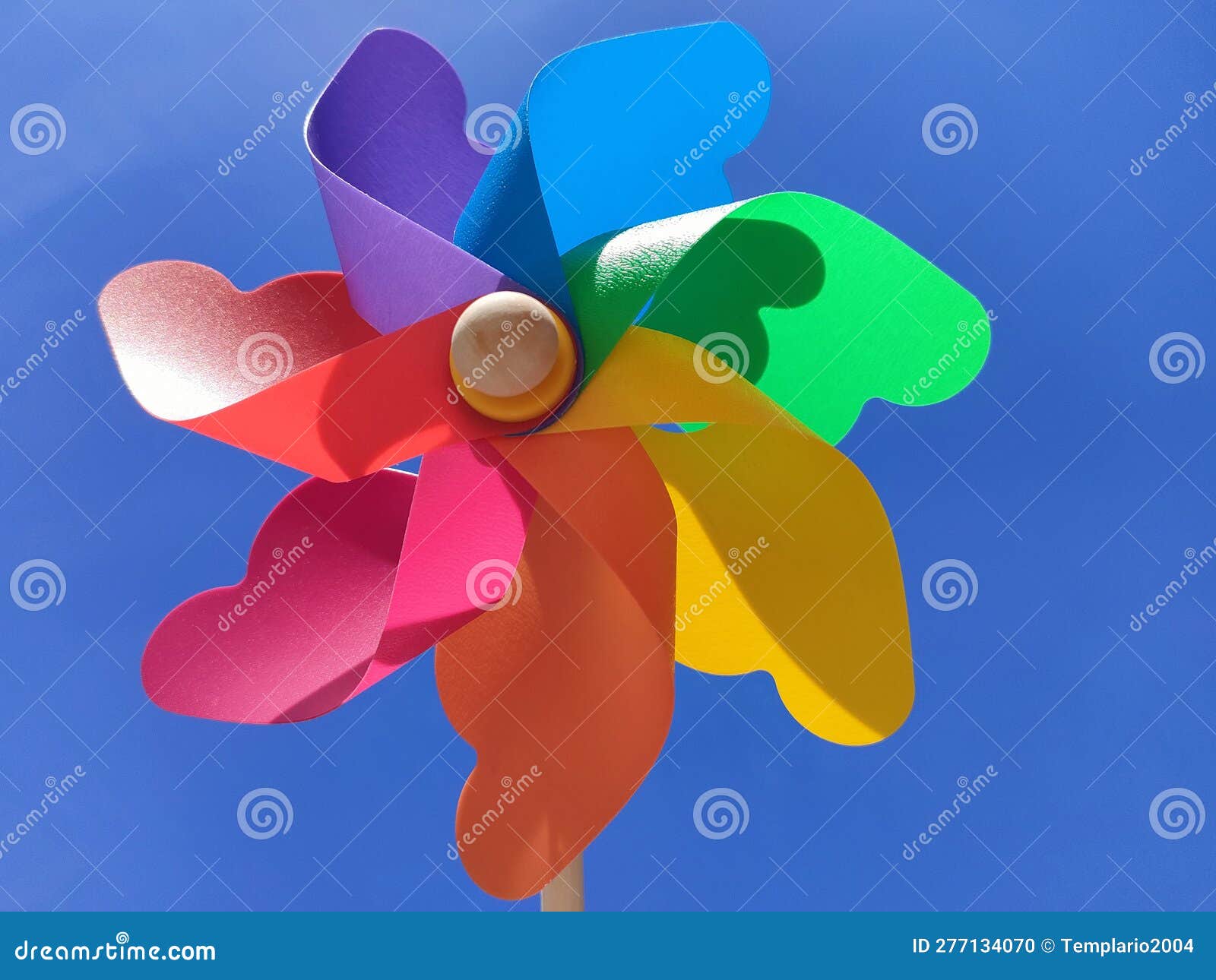 A pinwheel against the sky stock photo. Image of contrast - 277134070