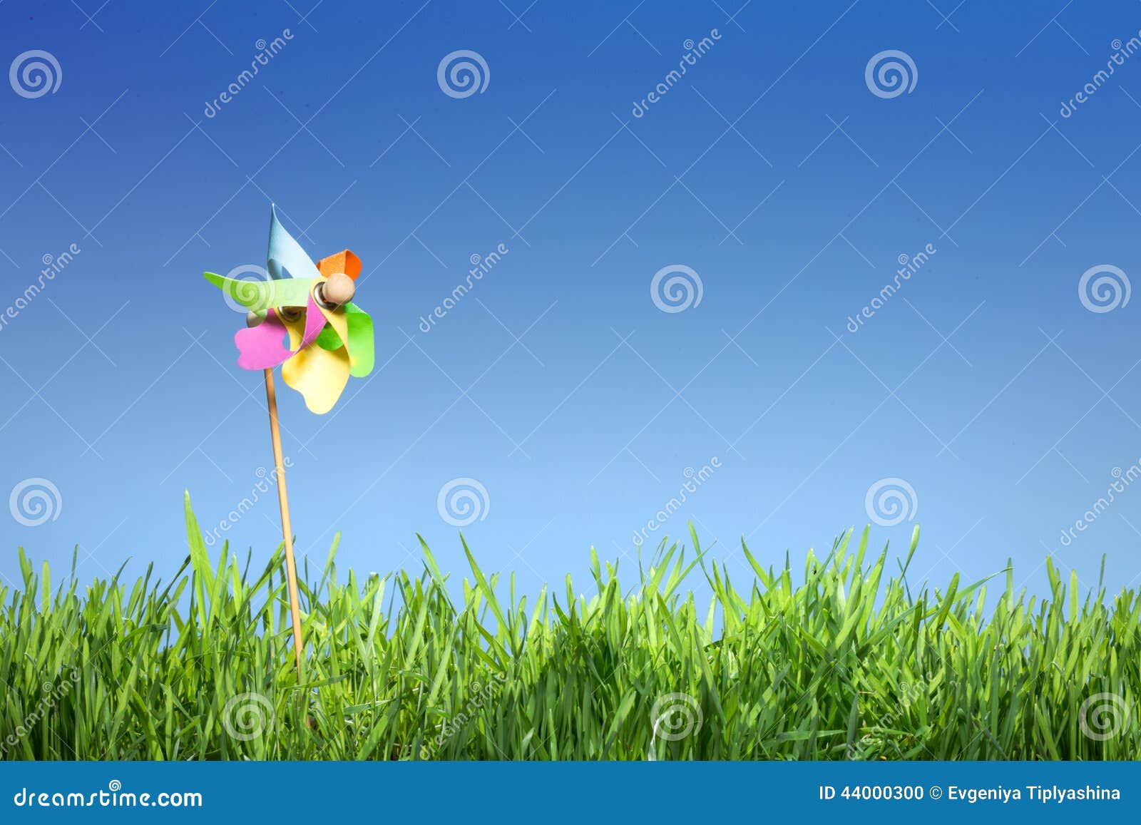 Pinwheel on the grass stock photo. Image of play, wind - 44000300